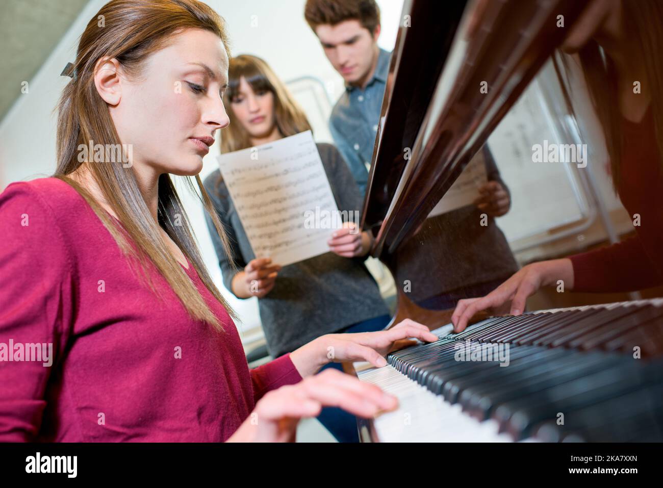 a piano artist and singers Stock Photo - Alamy