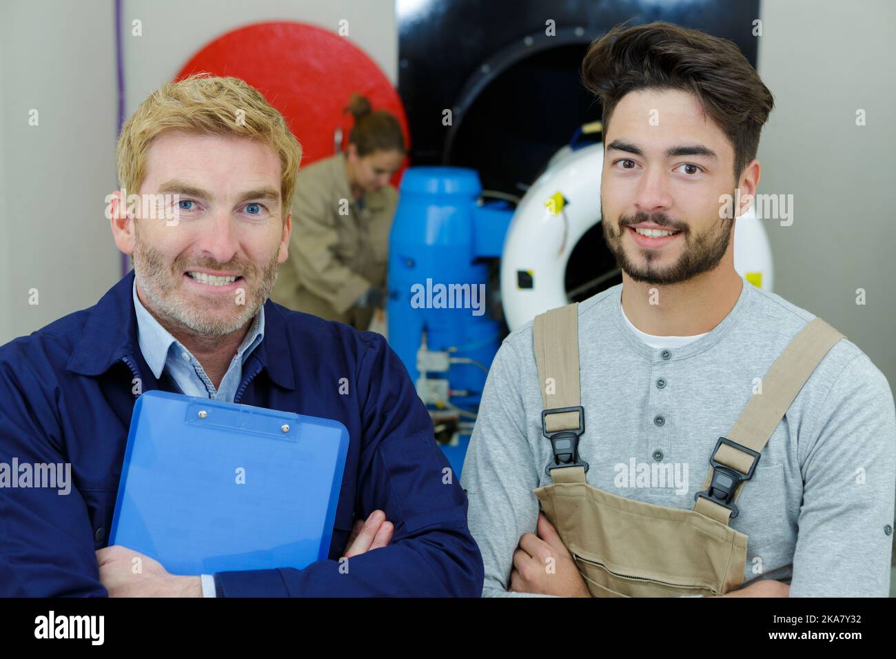 an apprentice and teacher posing Stock Photo - Alamy