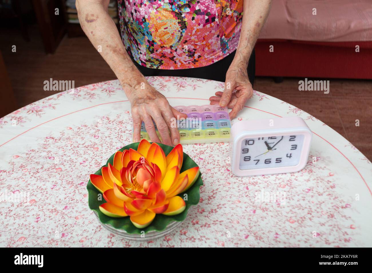 unrecognizable elderly woman prepares medication to take, home health ...