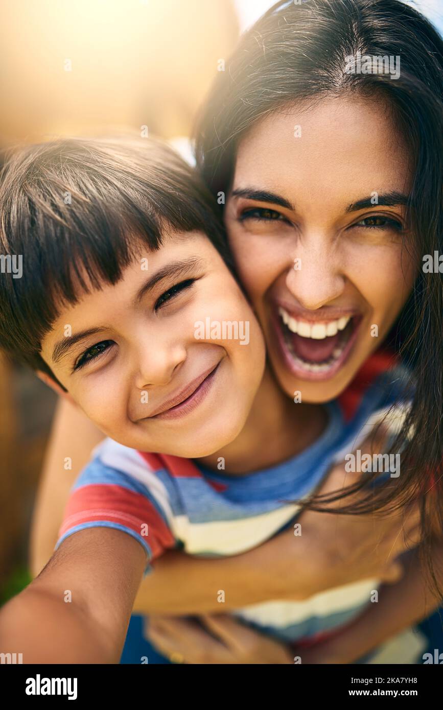 Like mother, like son. Closeup portrait of an attractive young woman ...