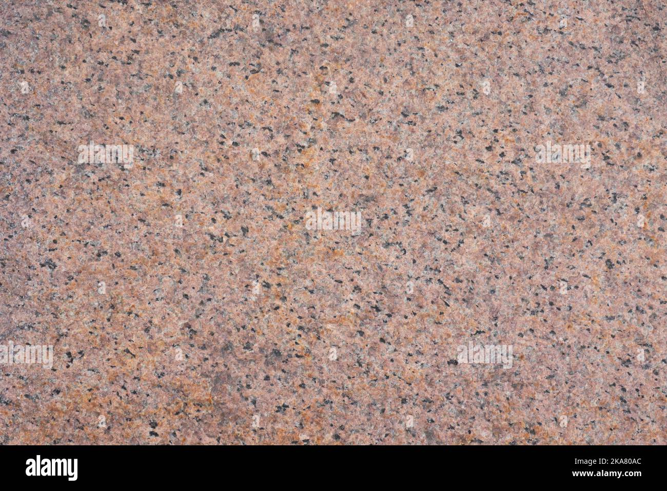 Background from red granite with potholes. Top view Stock Photo - Alamy