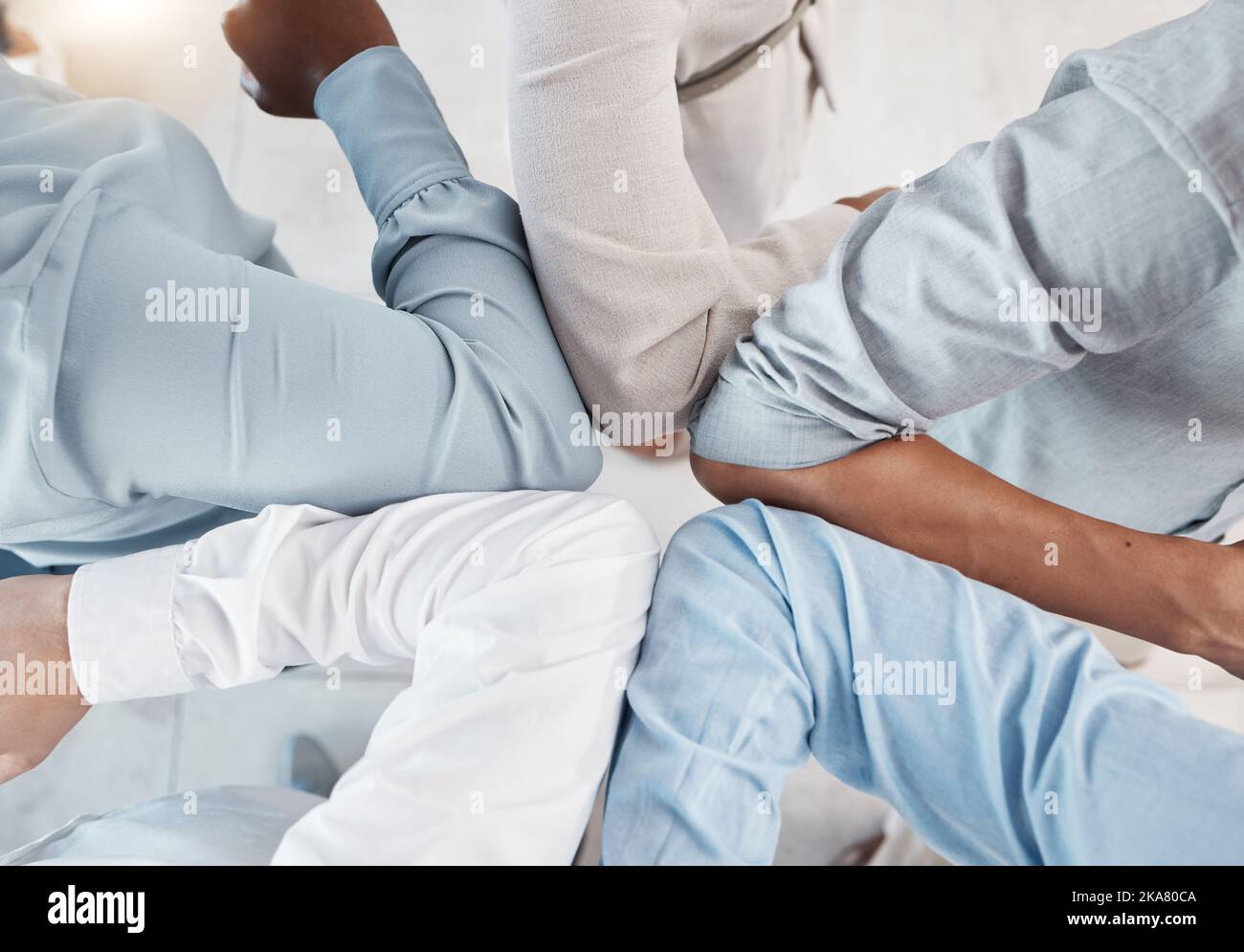 Diversity, arms and elbow greeting above in teamwork, collaboration or ...