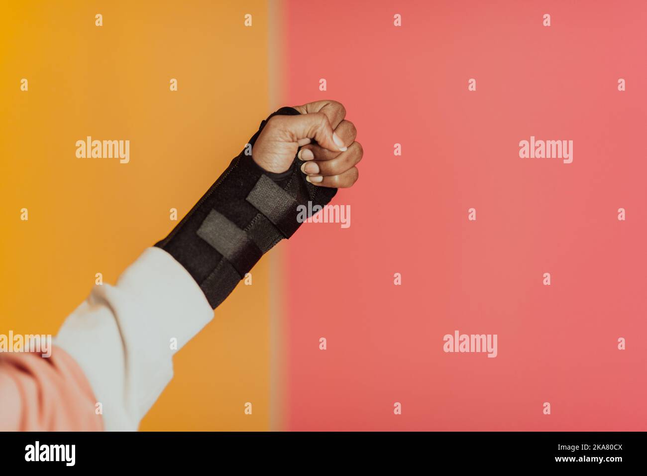 isolated hurt hand of afro girl on yellow background Stock Photo - Alamy