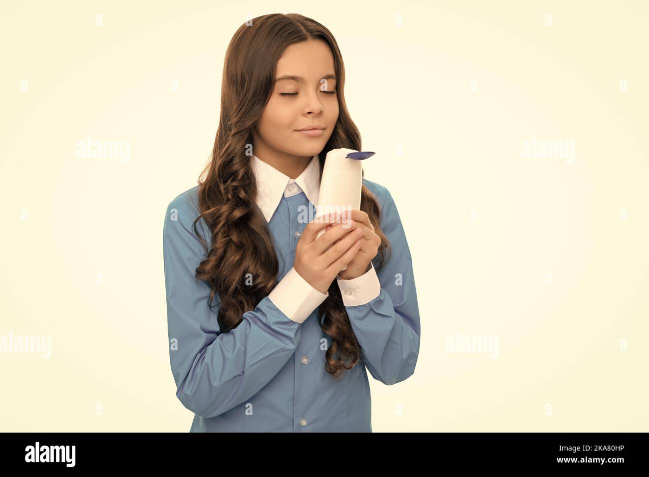 happy child long curly hair smell shampoo bottle isolated on white ...