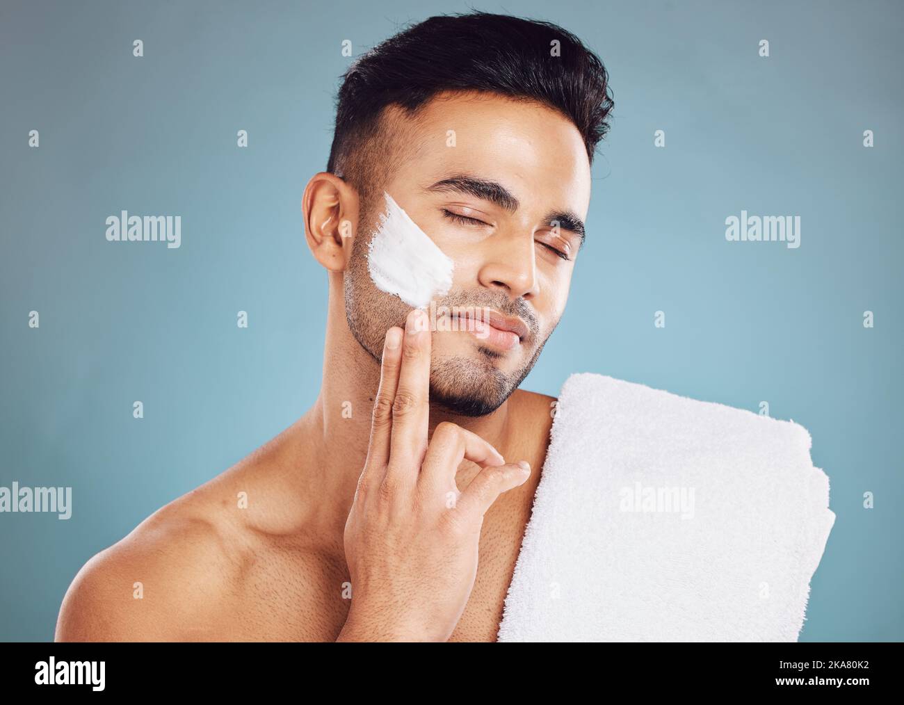Face, skincare cream and man facial morning routine for beauty care. Young Indian person ...