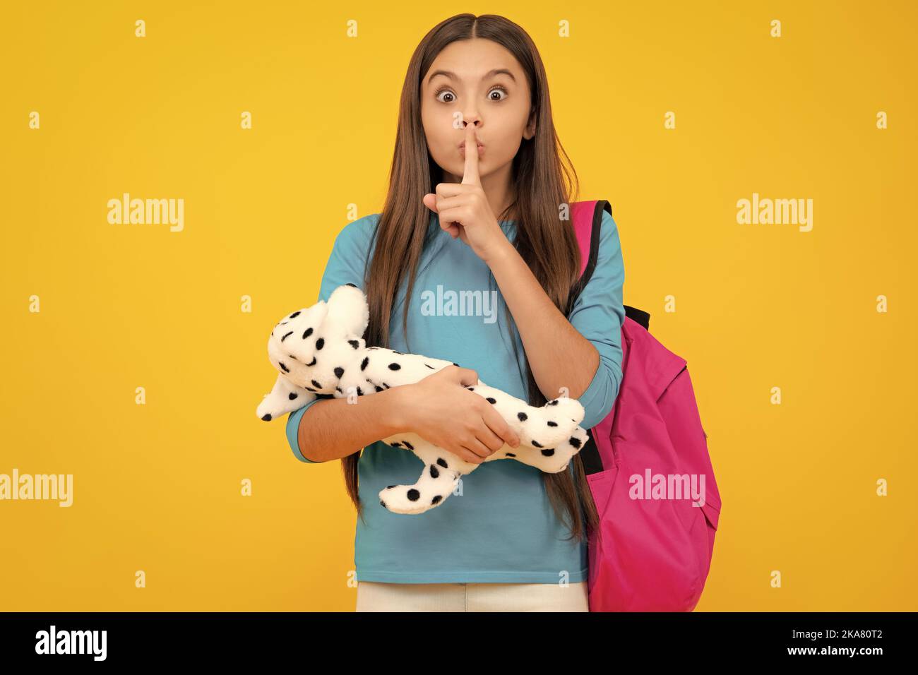 Funny face. Back to school. Teenager schoolgirl hold book with toy ...