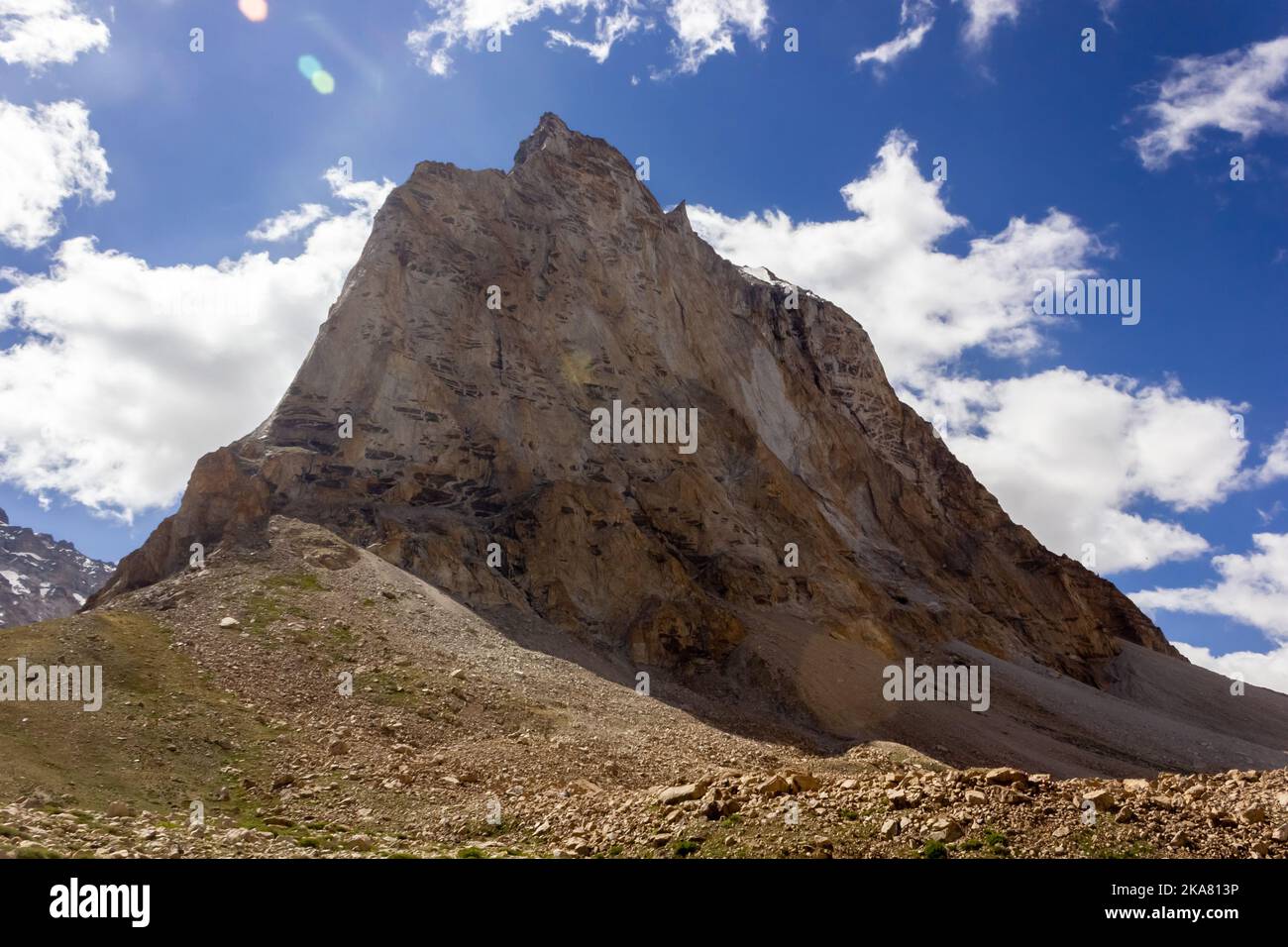 The Granite mountain peak of Mount Gumbok Rangjon with a blue sky in ...