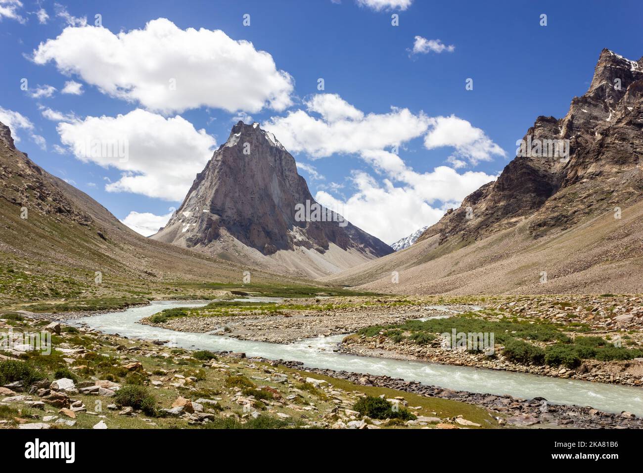 The Kargyak river with the granite mountain peak of Mount Gumbok ...