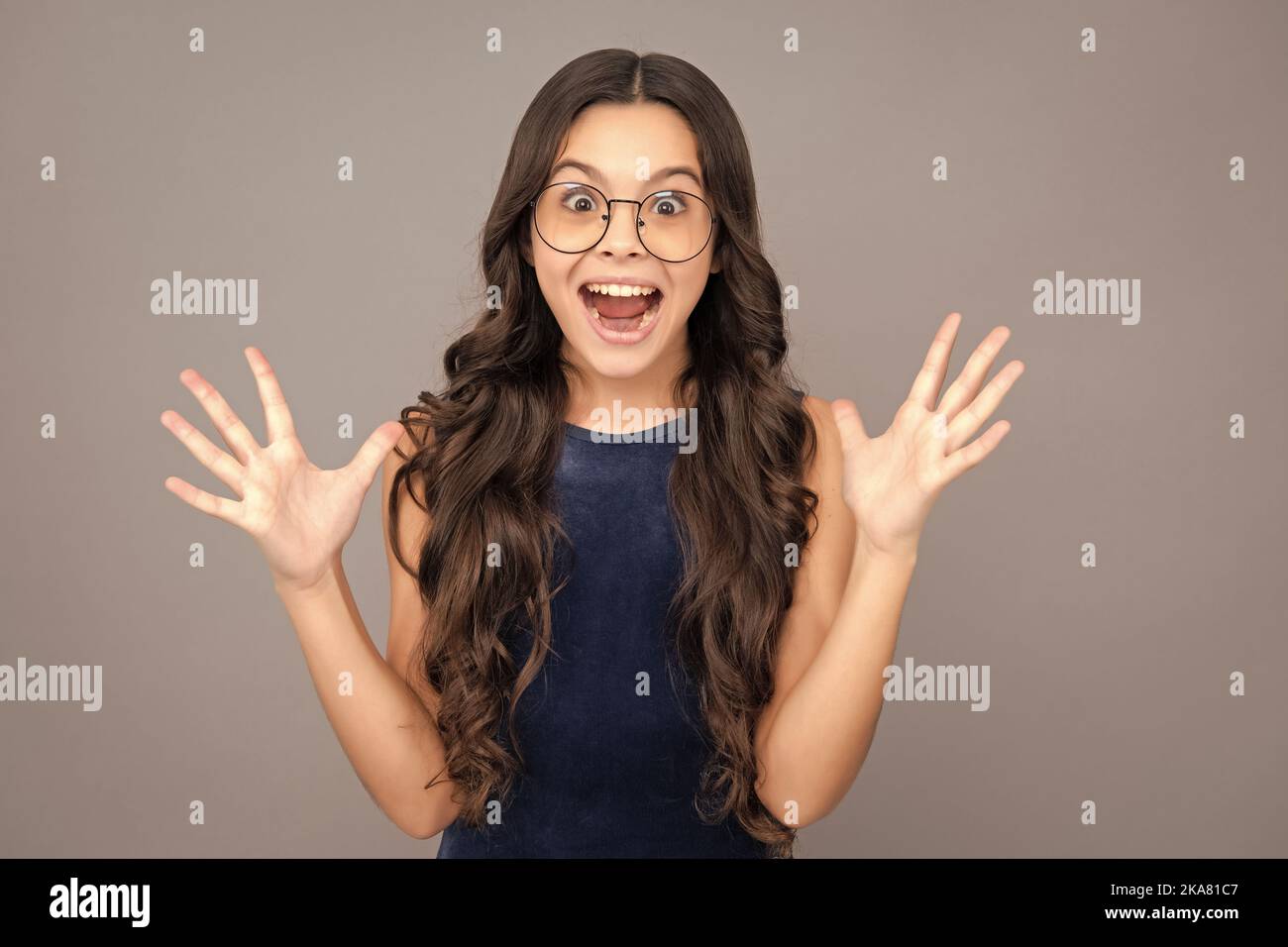 Portrait of emotional positive teenage child girl shouting in amazement ...