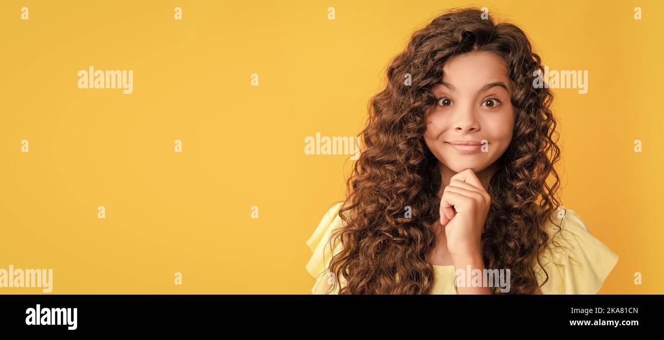 smiling teen girl with long curly hair and perfect skin, beauty. Child ...
