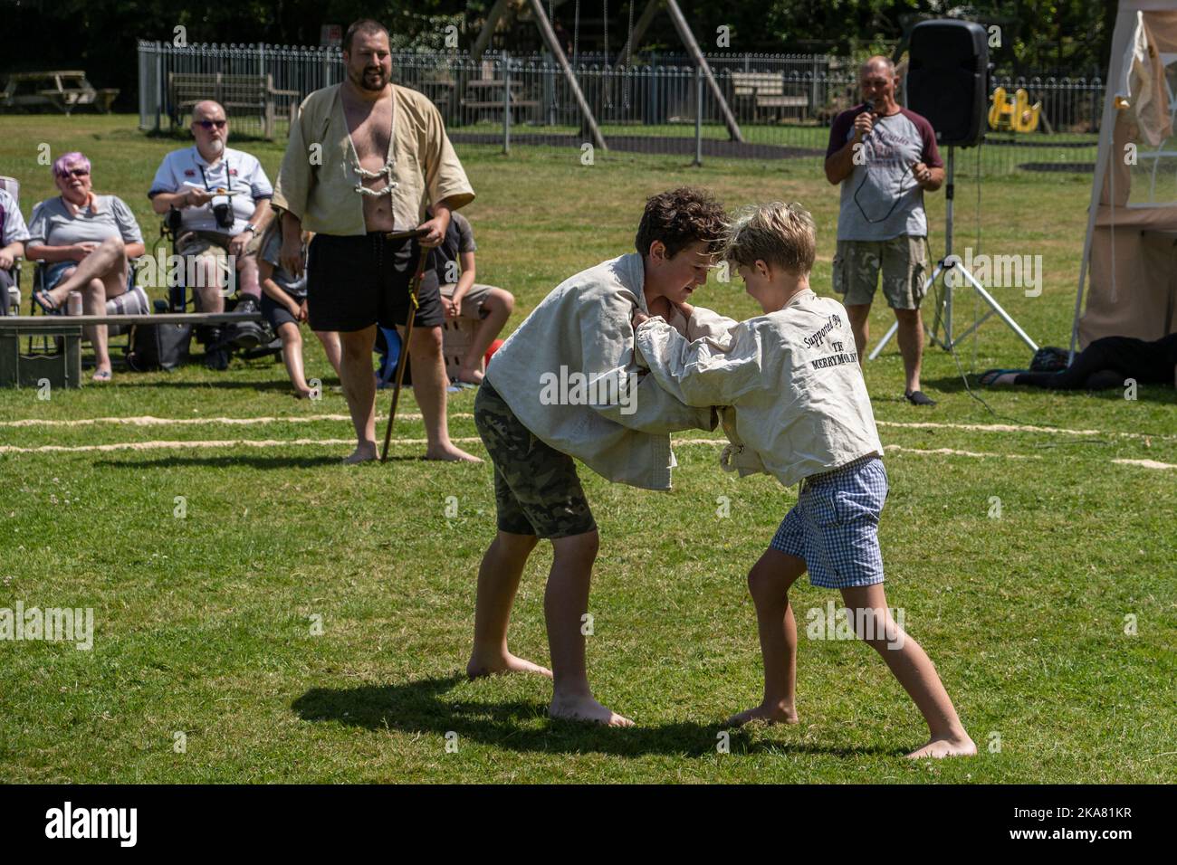 A judge referee Stickler watching two young boys competing in the Grand ...