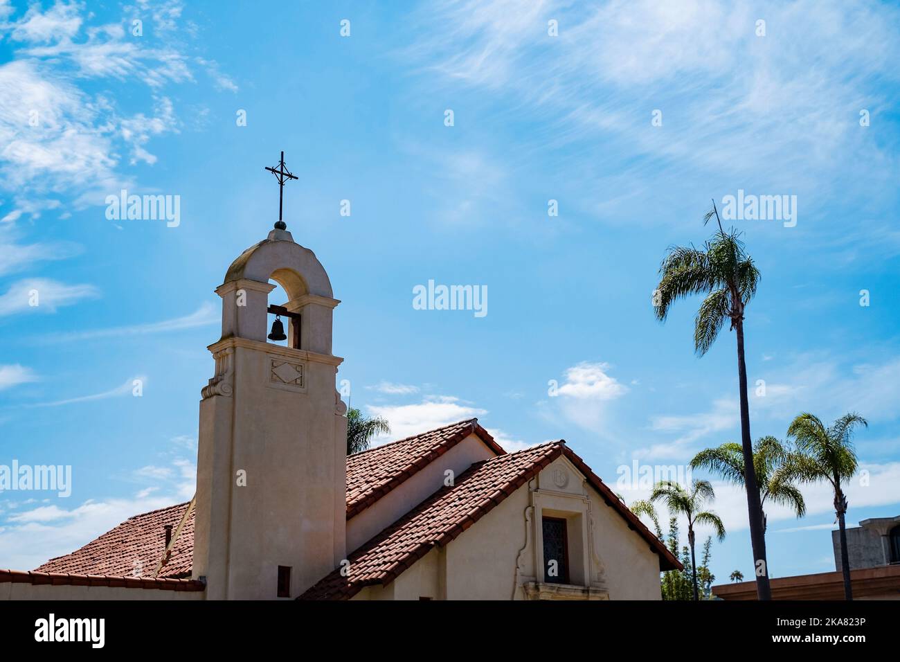 La Jolla Spanish mission style church bell tower with palm trees in San ...