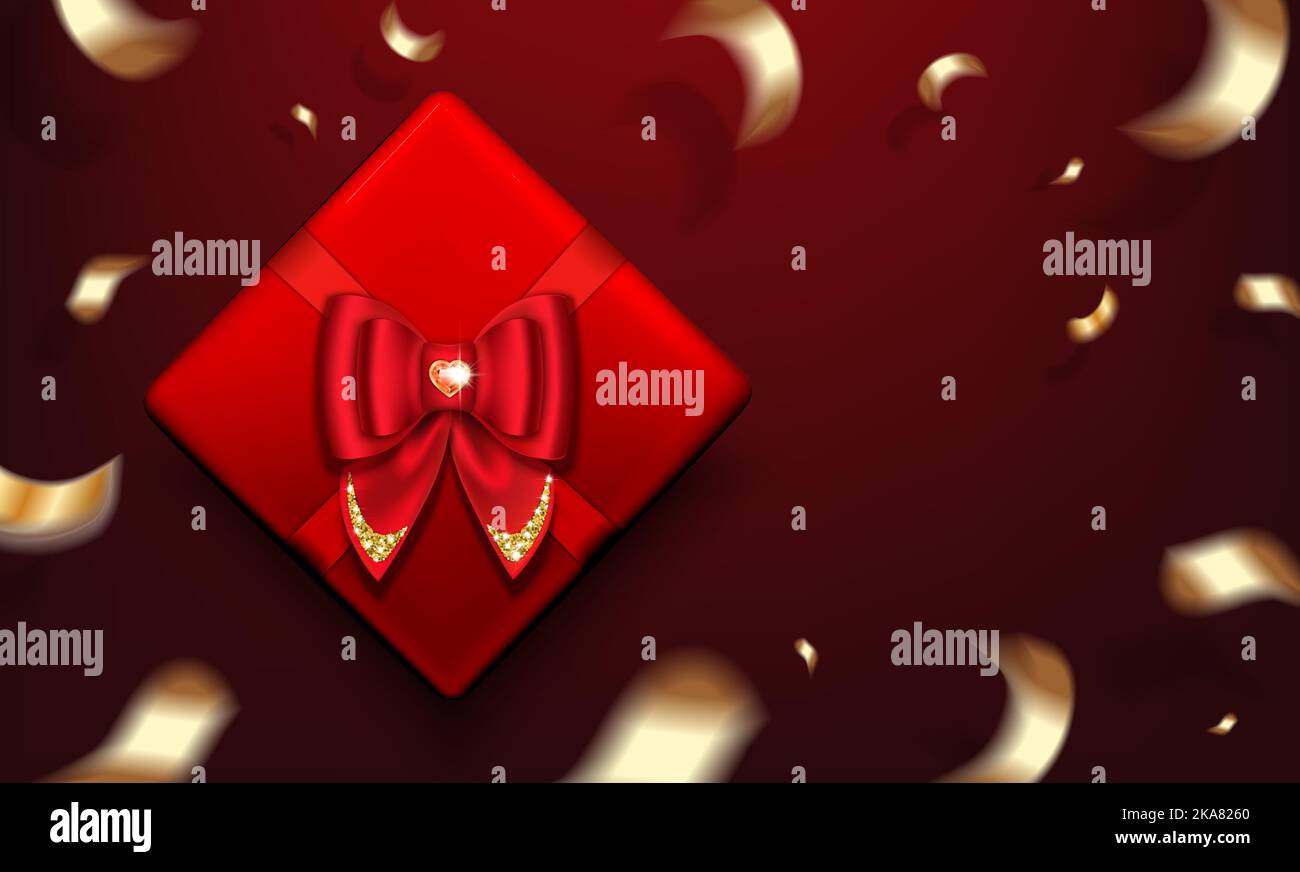 Red gift box with a bow and a ruby heart-shaped gemstone. Golden ...