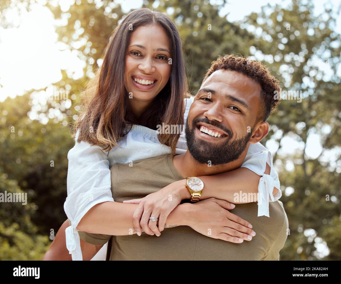Love, black couple and with smile hug, bonding and happy together ...