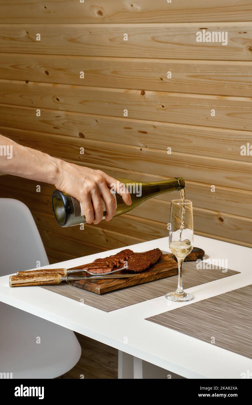 Prosecco or champagne pouring in a glass Stock Photo - Alamy