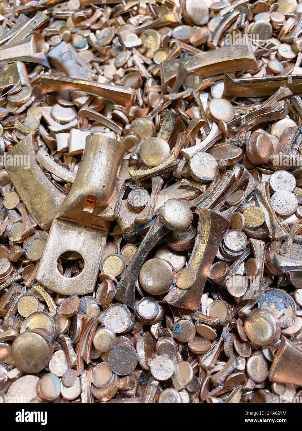 Copper punchings in an abstract pattern. Industrial waste for recycling ...