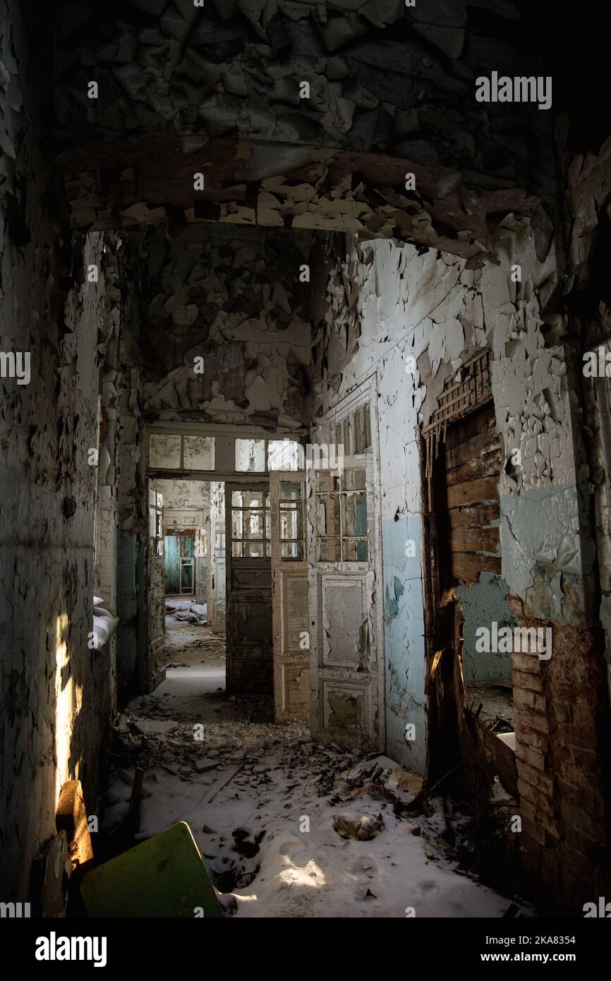A vertical shot of an abandoned old broken building interior Stock ...