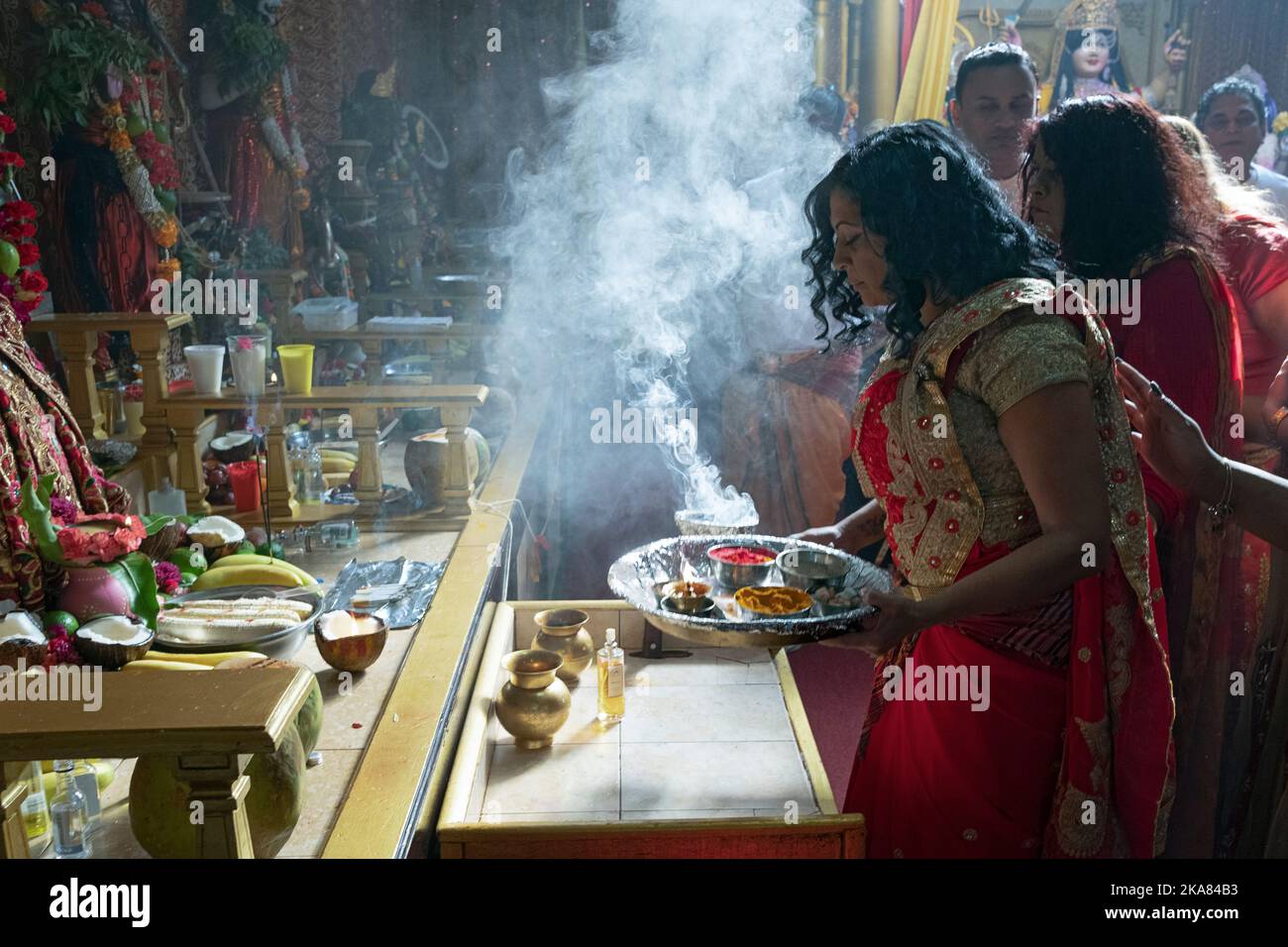 Devout Hindu devotees make offerings to their deities in a Hindu ...