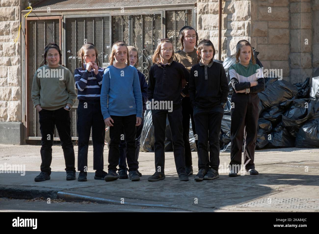 During yeshiva recess, 8 orthodox Jewish boys, each with long peyot ...