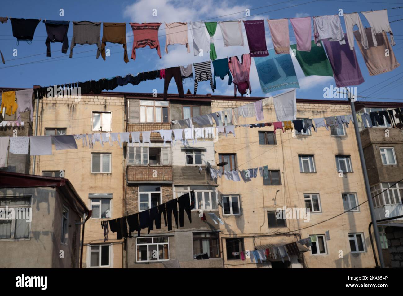 A scenic view of loundry on lines between houses in Stepanakert ...