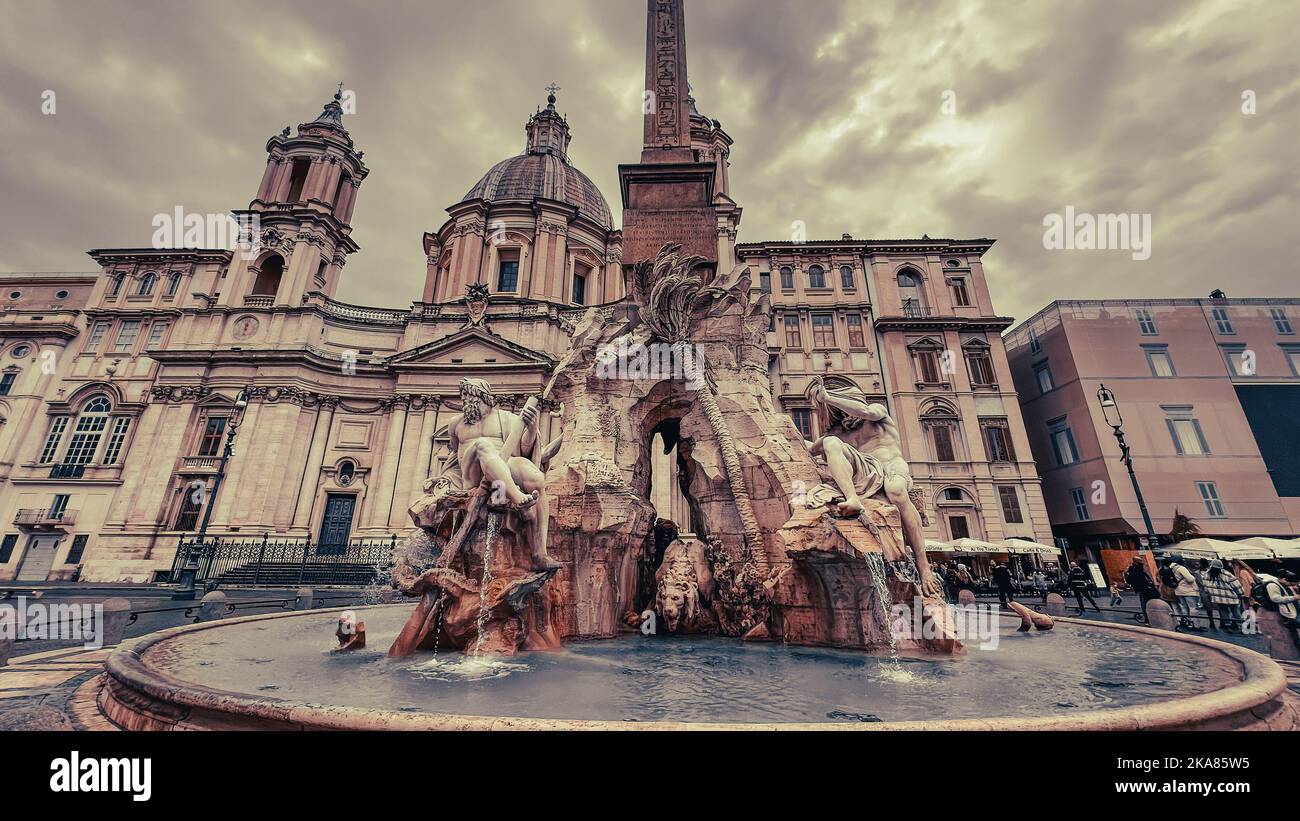 A scenic view of the Fiumi Fountain in Rome, Italy in cloudy sky ...
