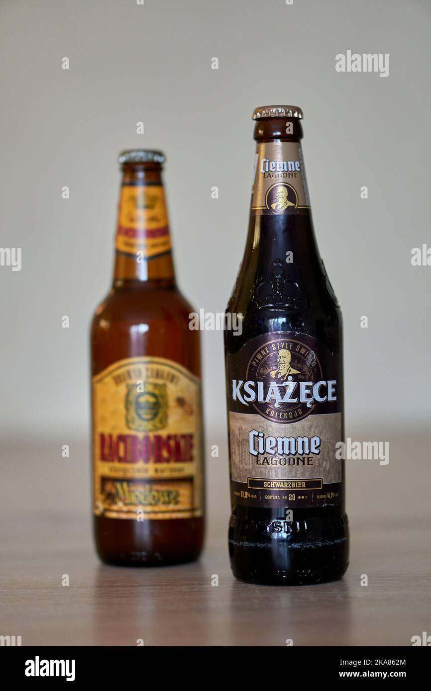 A vertical shot of the Polish Ksiazece and Raciborskie beer bottles on ...