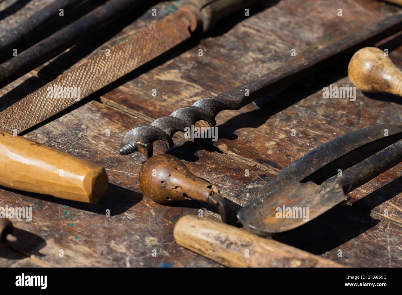 Antique artisan carpenter's tools on a wooden board, selective approach ... Antique artisan carpenter's tools on a wooden board, selective approach ...