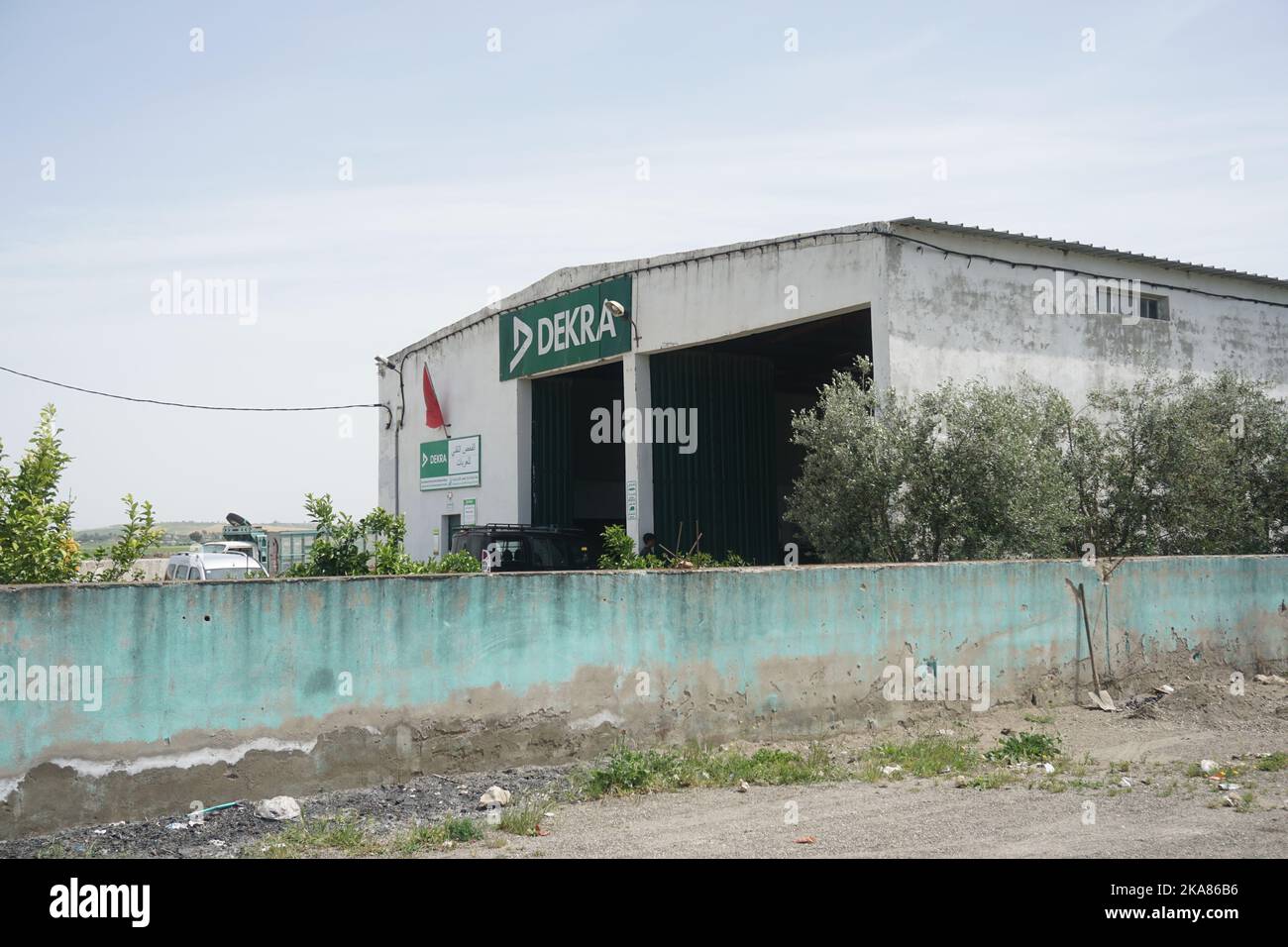 A closeup of the Dekra building in Morocco on blue sky background Stock ...