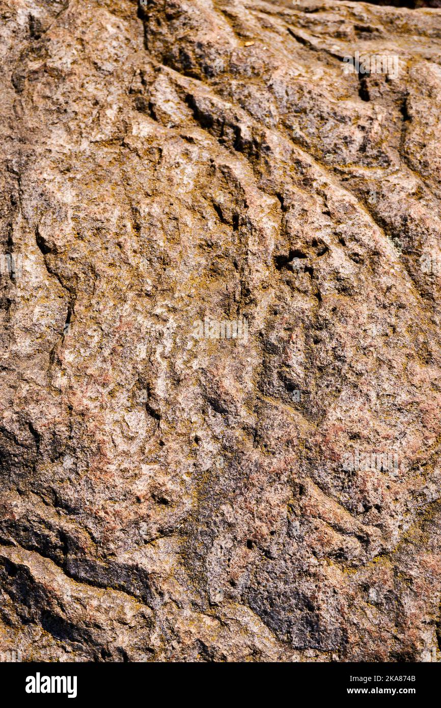 A rough rock in the sun Stock Photo - Alamy