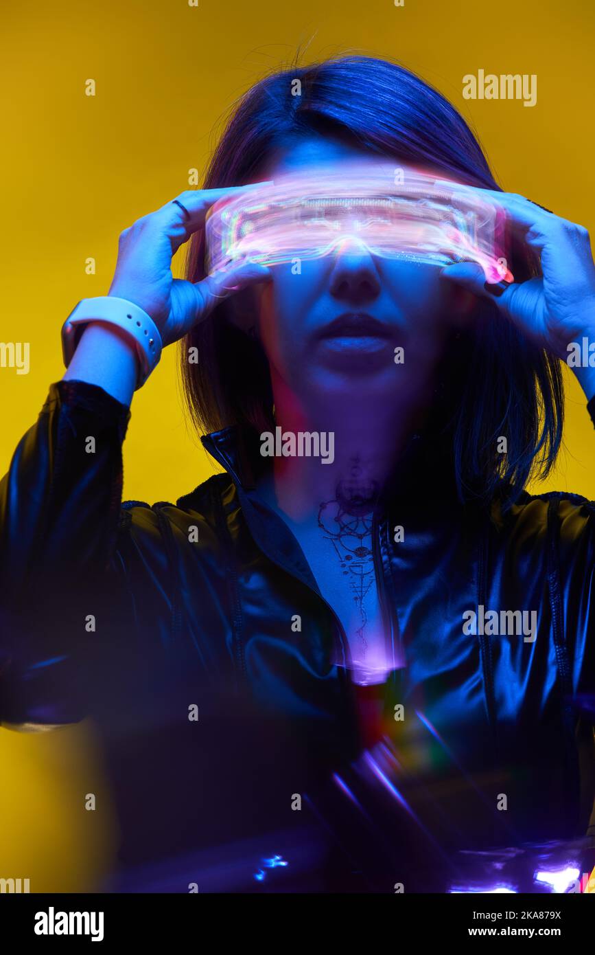 Woman is using augmented reality headset. Concept of virtual, augmented ...