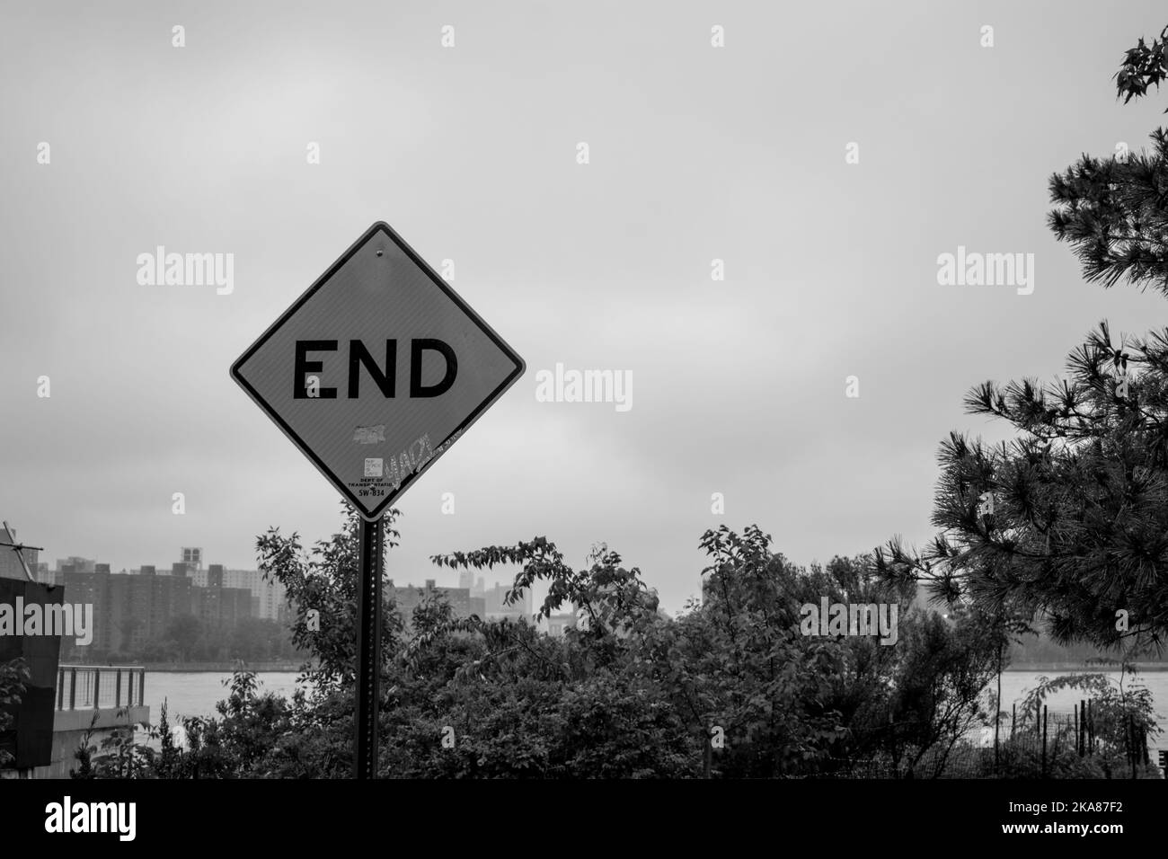 A grayscale shot of an end of the road warning sign Stock Photo - Alamy