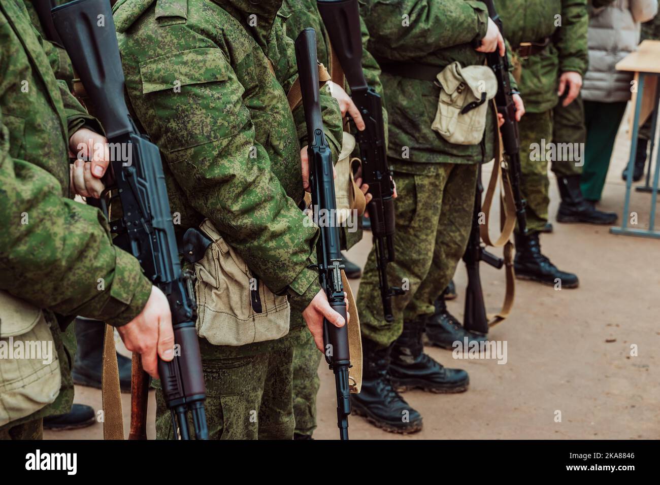 Soldiers with guns in their hands. Line of soldiers in uniform with ...
