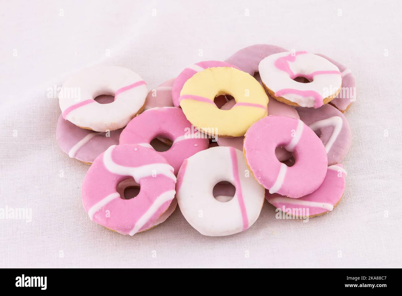 A closeup of delicious crunchy iced party rings isolated on white ...