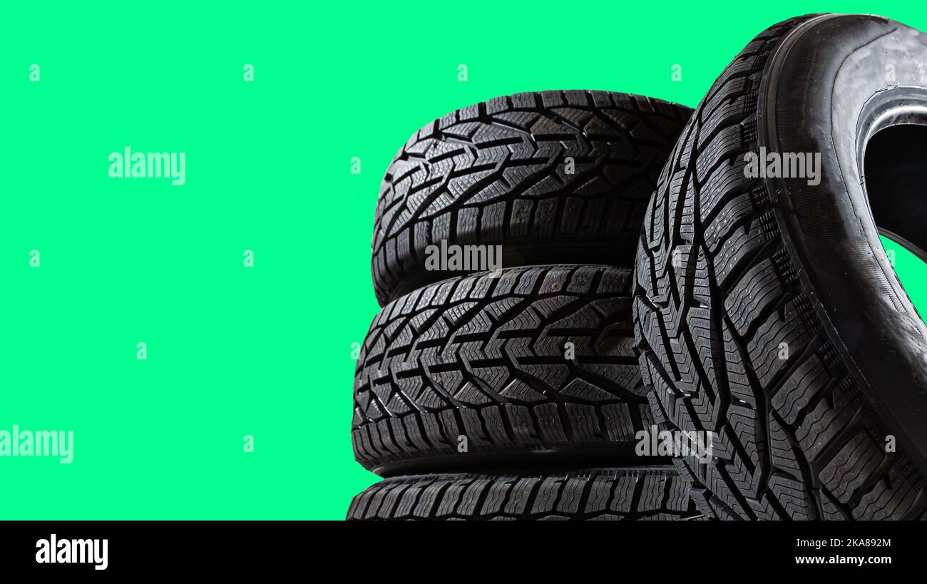 Stack of wheel new black tyres for winter car driving isolated on ...