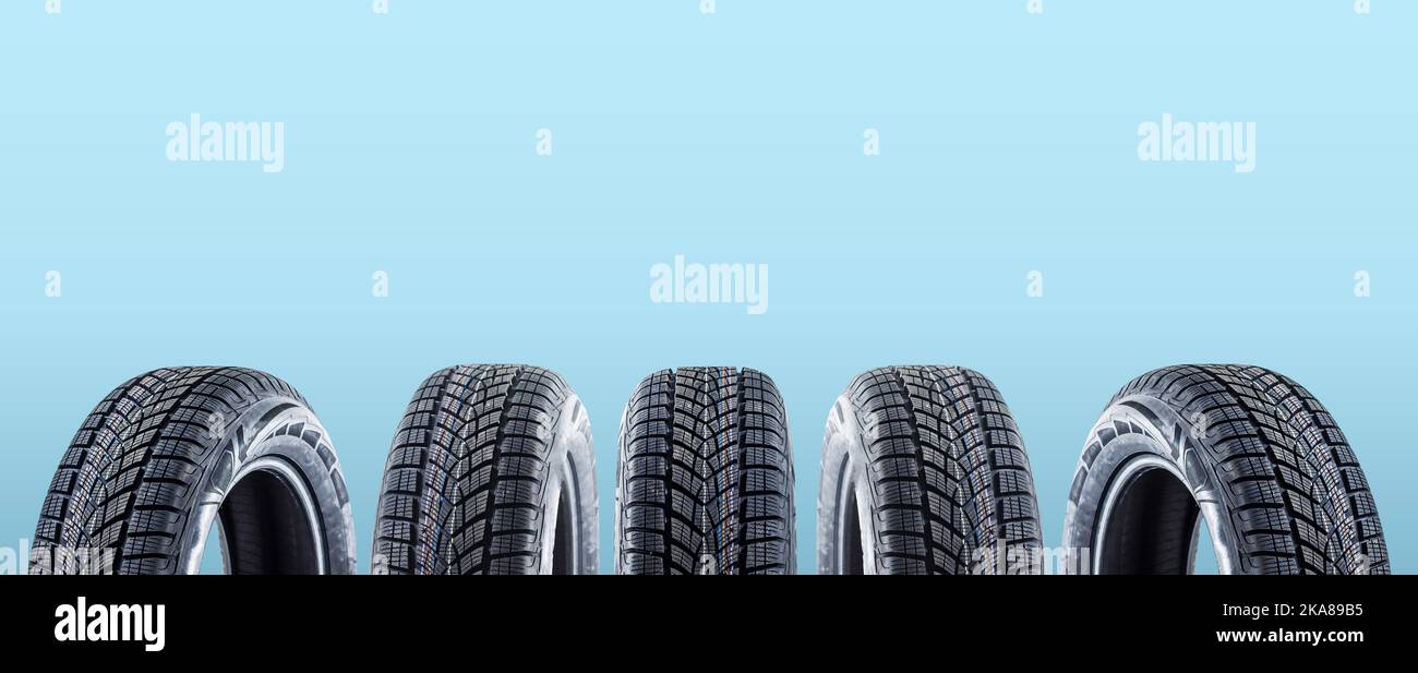Stack of wheel new black tyres for winter car driving isolated on ...