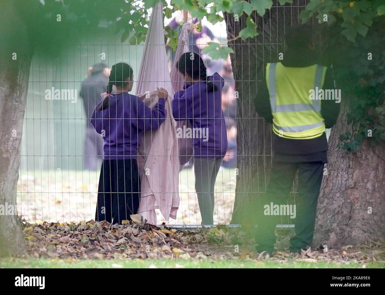 Children play inside the Manston immigration short-term holding ...