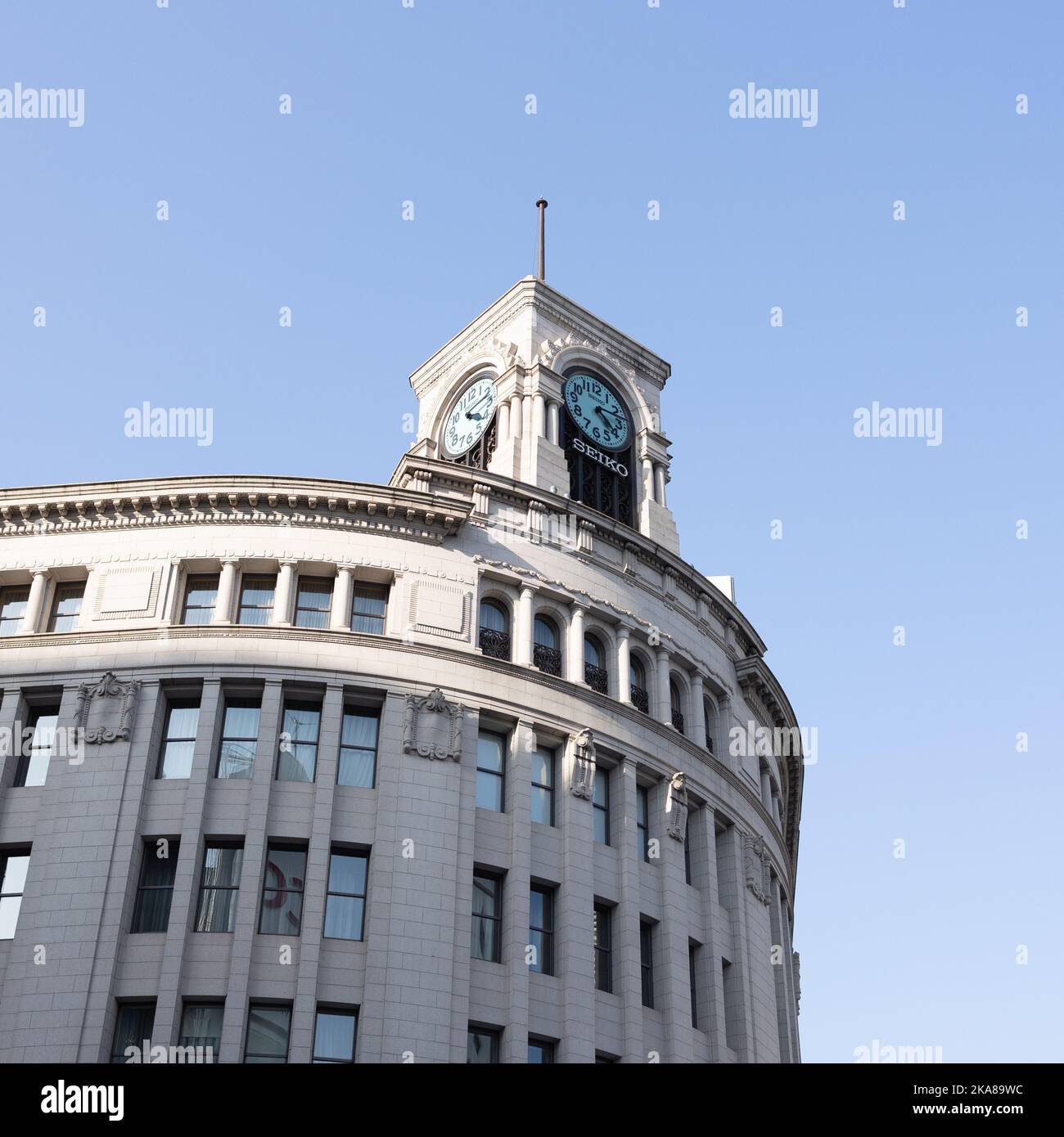 A low angle shot of the Hattori Clock Tower in Tokyo, Japan Stock Photo ...