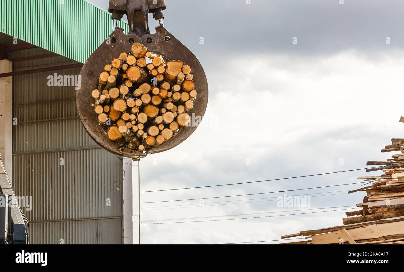 Industrial log loader at lambermill Stock Photo - Alamy
