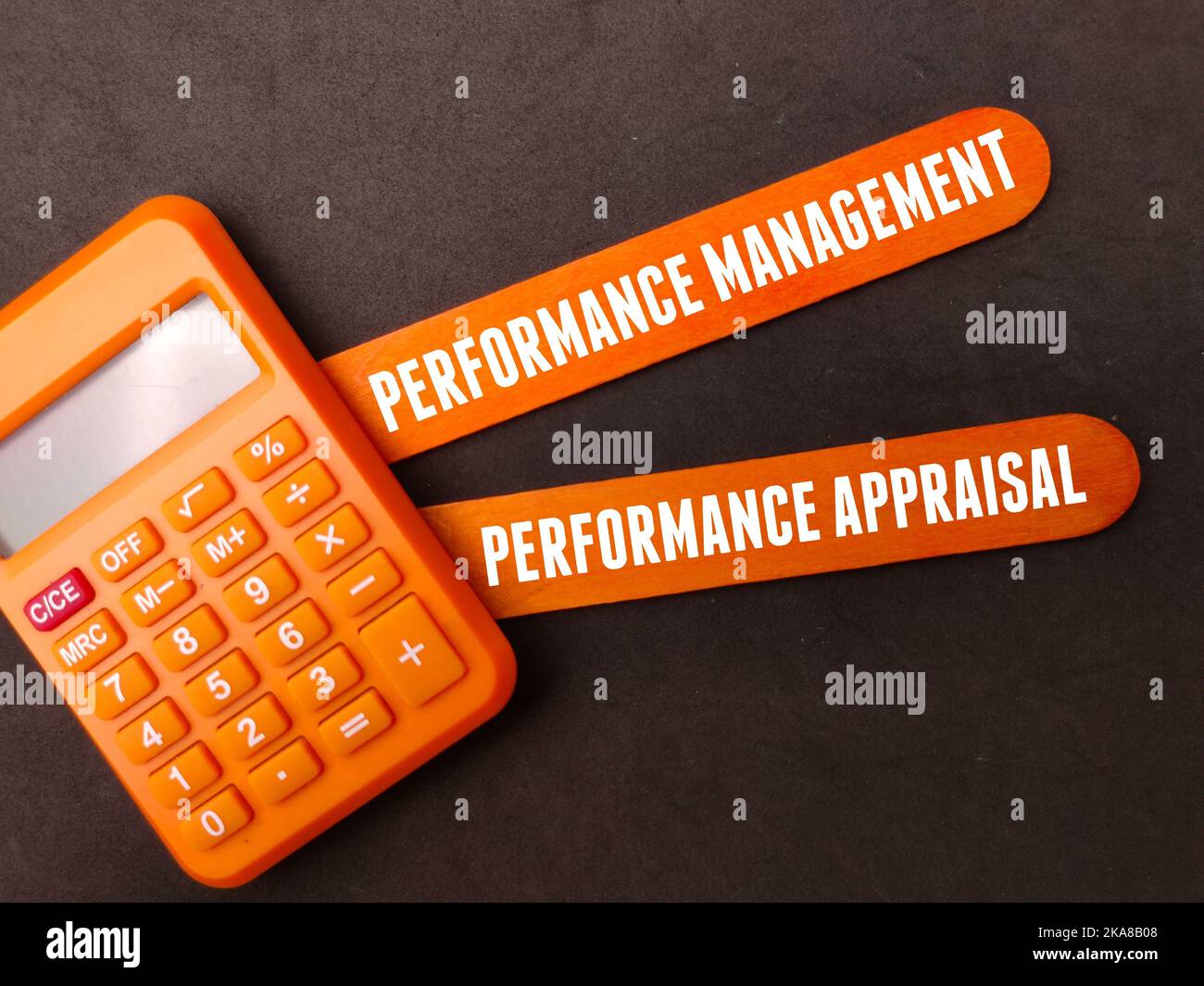 An orange calculator with the words Performance Management and ...