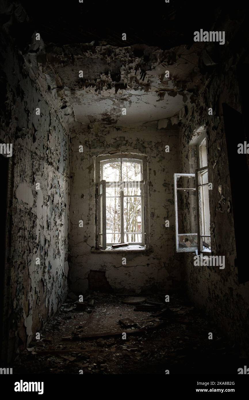 A vertical shot of an abandoned old broken building interior Stock ...