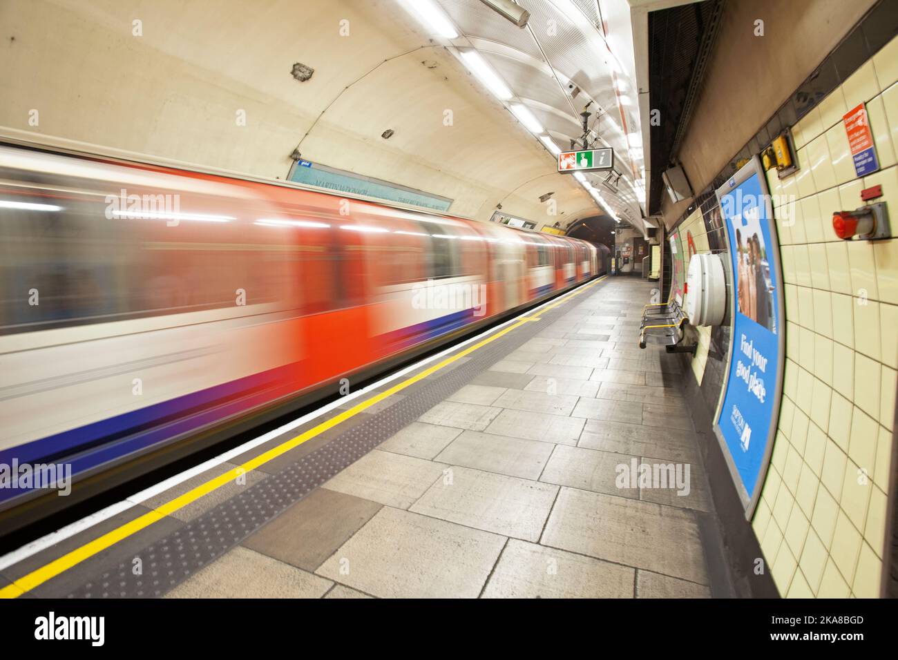Underground train going leaving station Stock Photo - Alamy