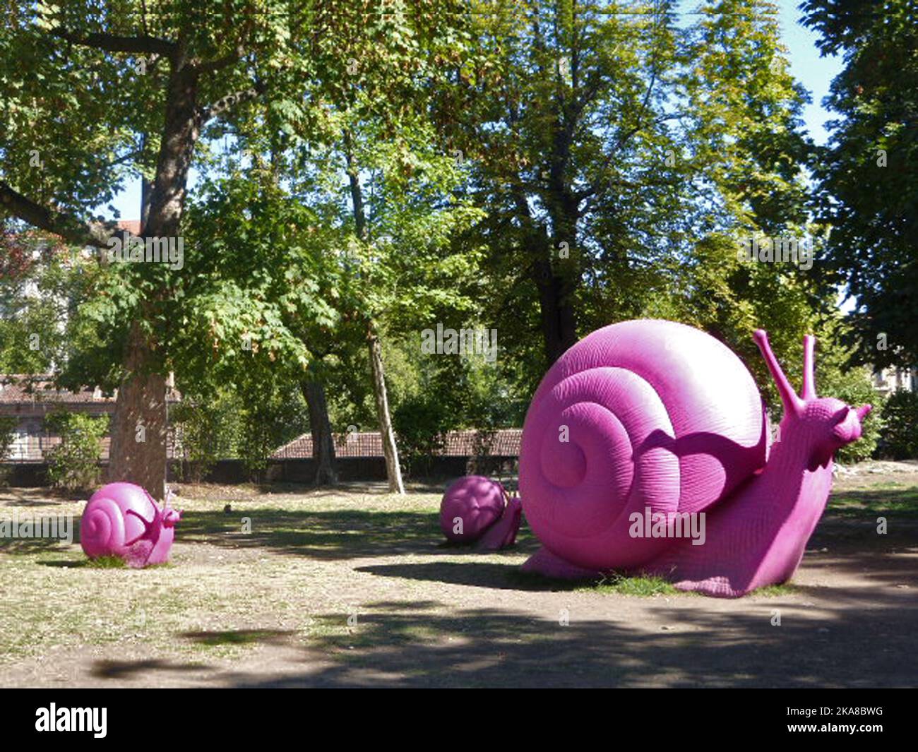 Mother snail and two offspring in a playground in the Giardini Reali di ...