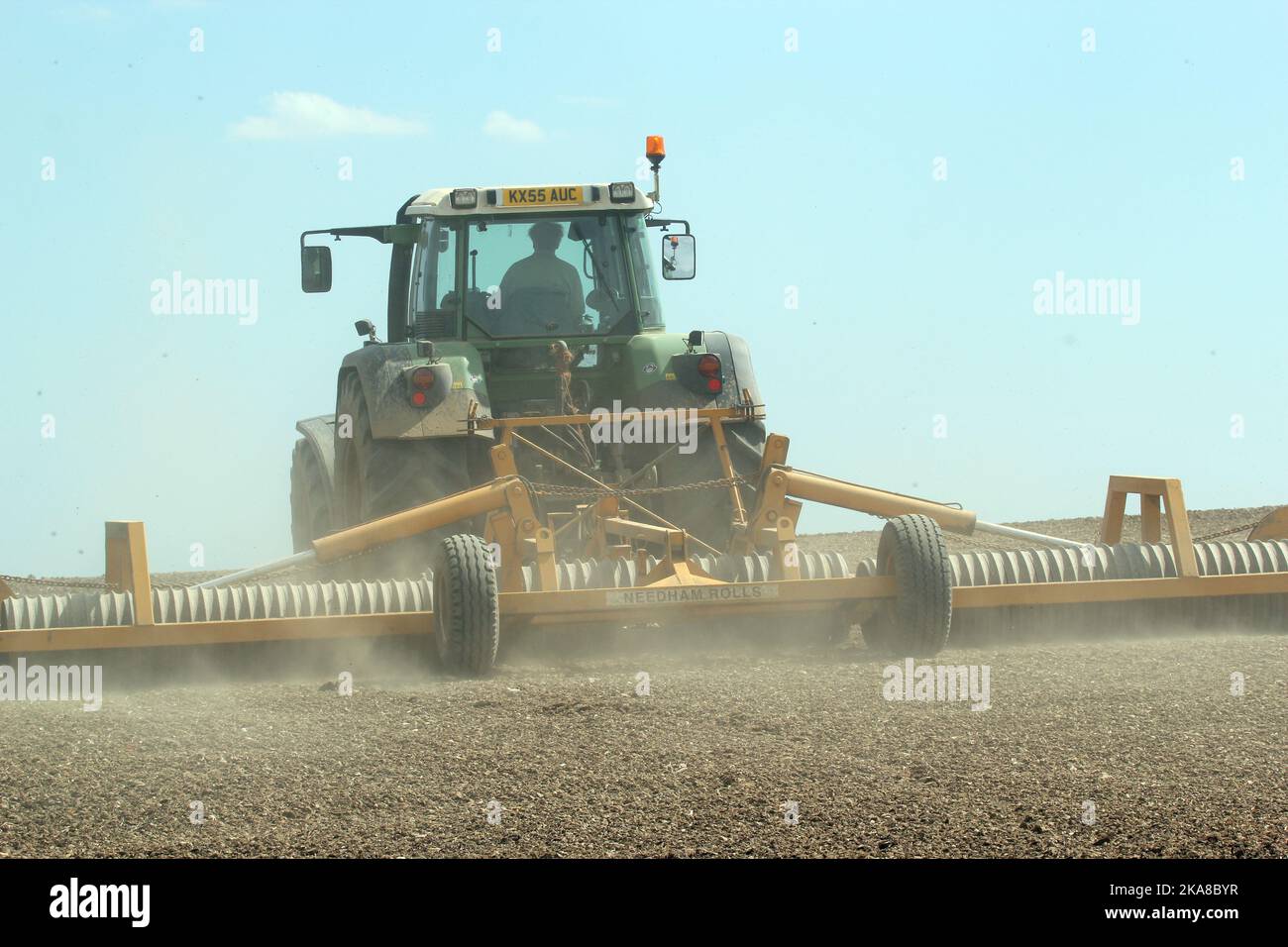 Tracor breaking up the earth ready to sow seeds. Common agricultural ...