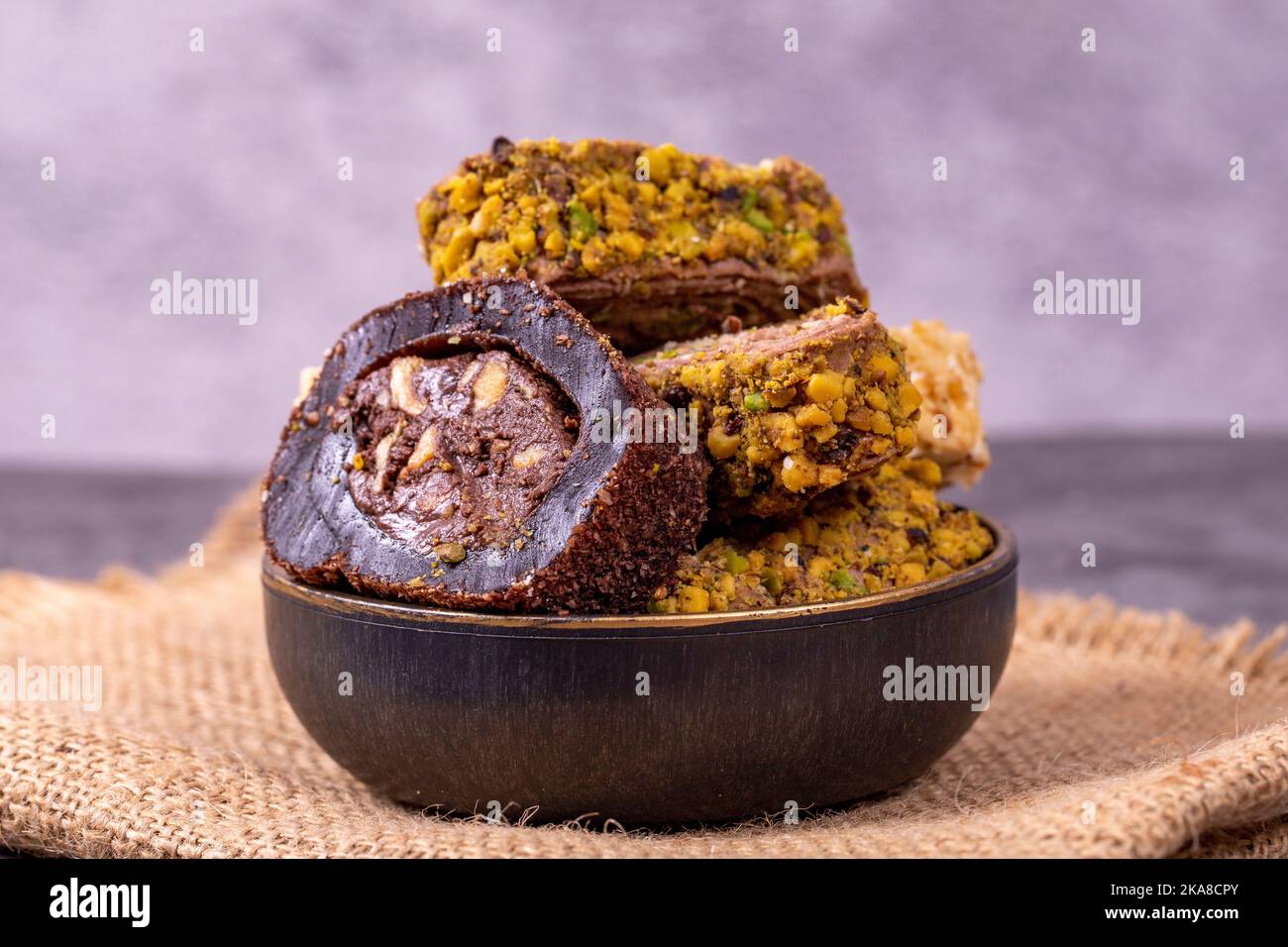 Mixed Turkish delight varieties on a dark background. Pistachio ...