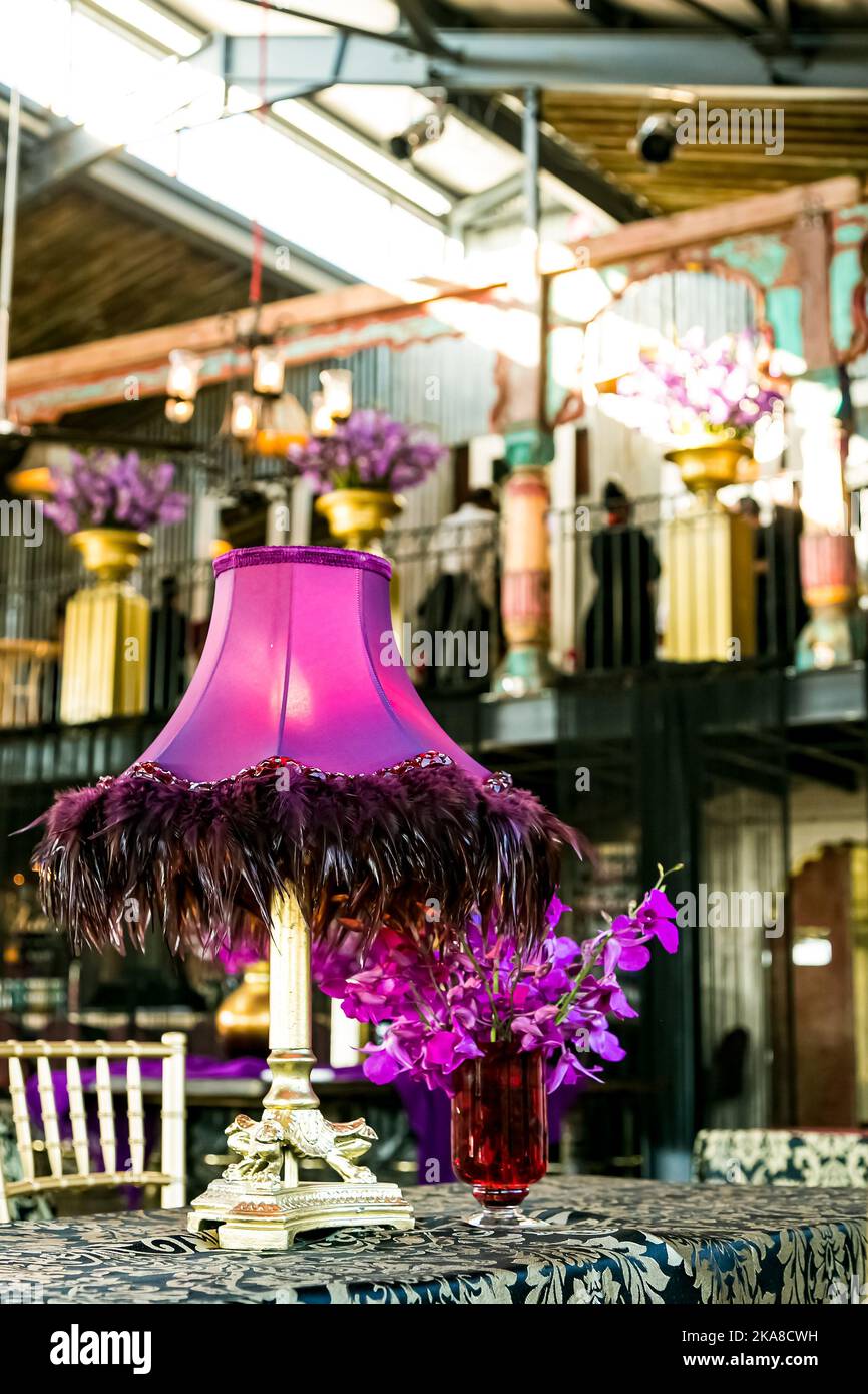 A purple themed floral decor in venue for party event Stock Photo - Alamy
