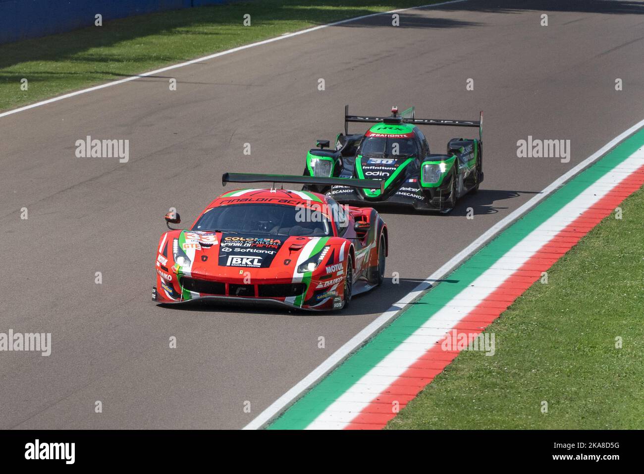 A beautiful racing cars on Imola track the 24h racing day under ...