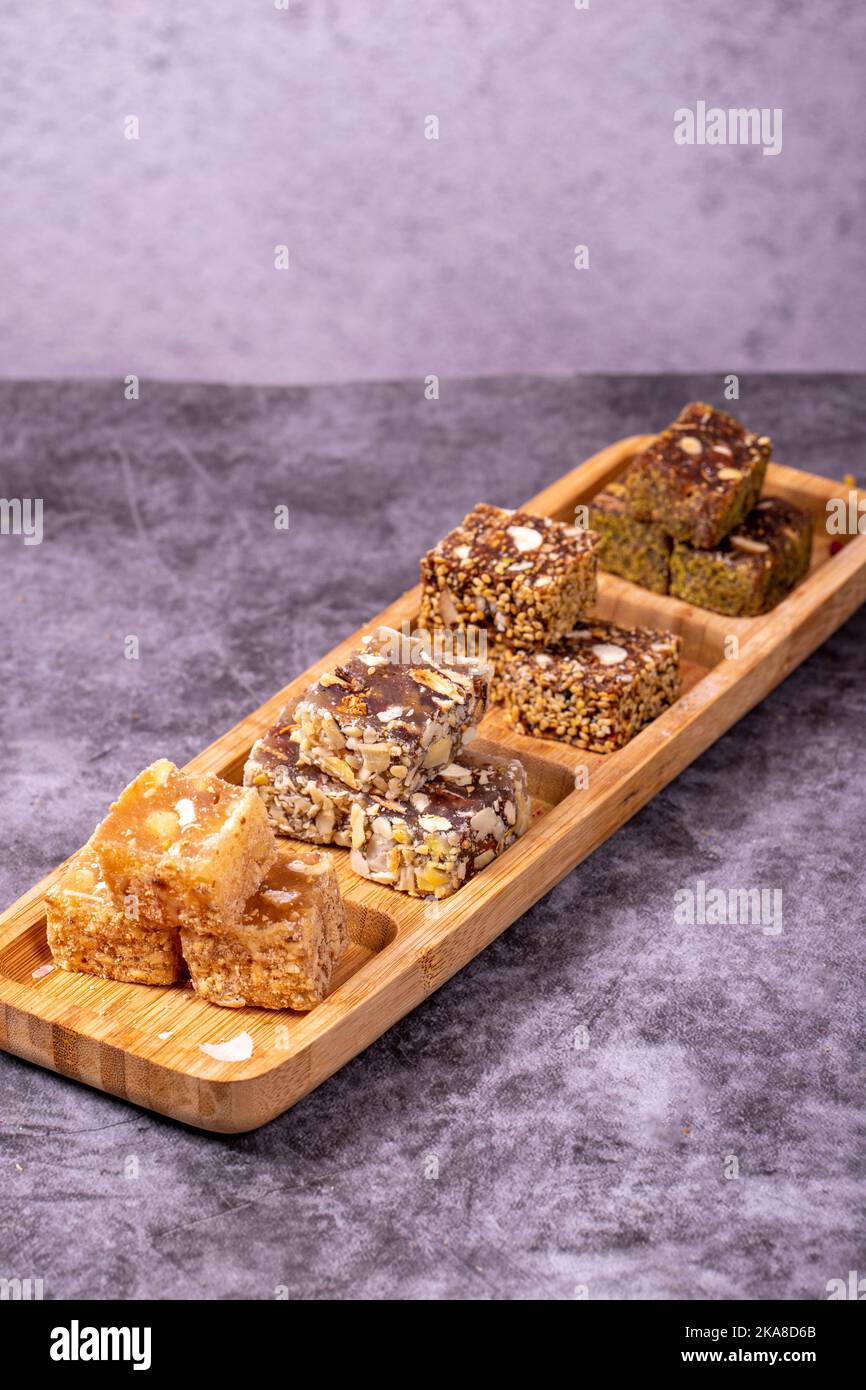 Mixed Turkish delight varieties on a dark background. Pistachio ...