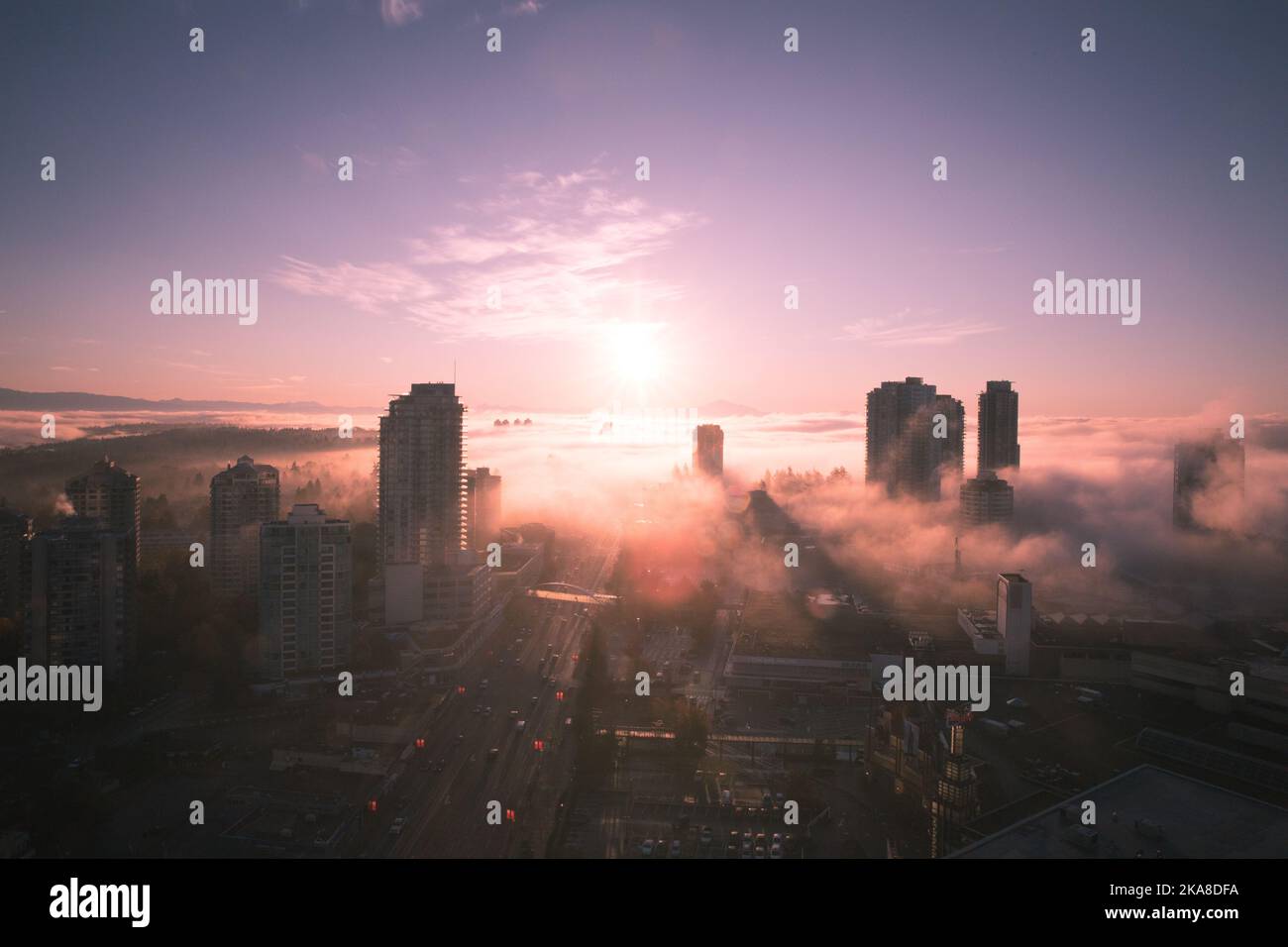 An aerial cityscape of Vancouver surrounded by tall buildings during ...