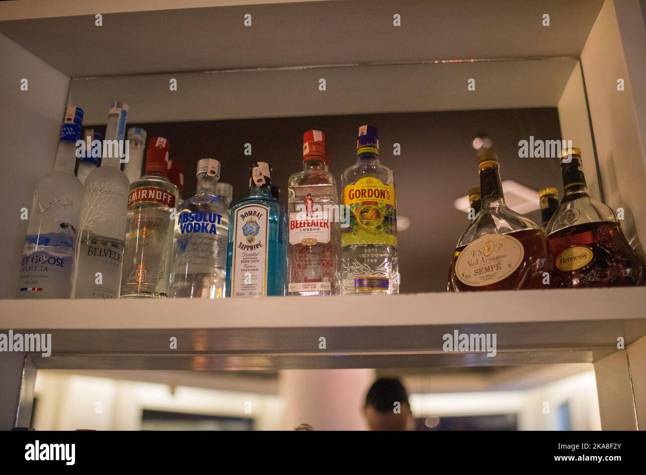 Different alcohol bottle on the shelf of a restaurant bar Stock Photo ...