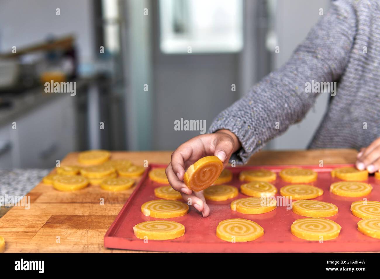 elementary age boy making cookies in wintertime Stock Photo - Alamy